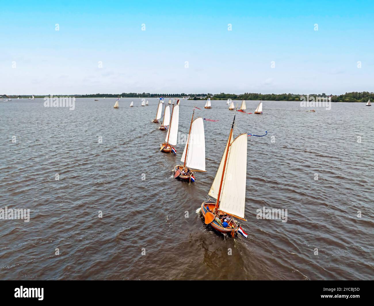 Aerial from admiral sailing with old wooden ships on the Heegermeer in ...