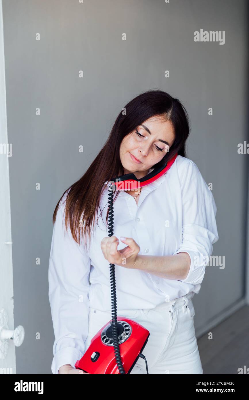 Woman corded telephone on hi-res stock photography and images - Alamy