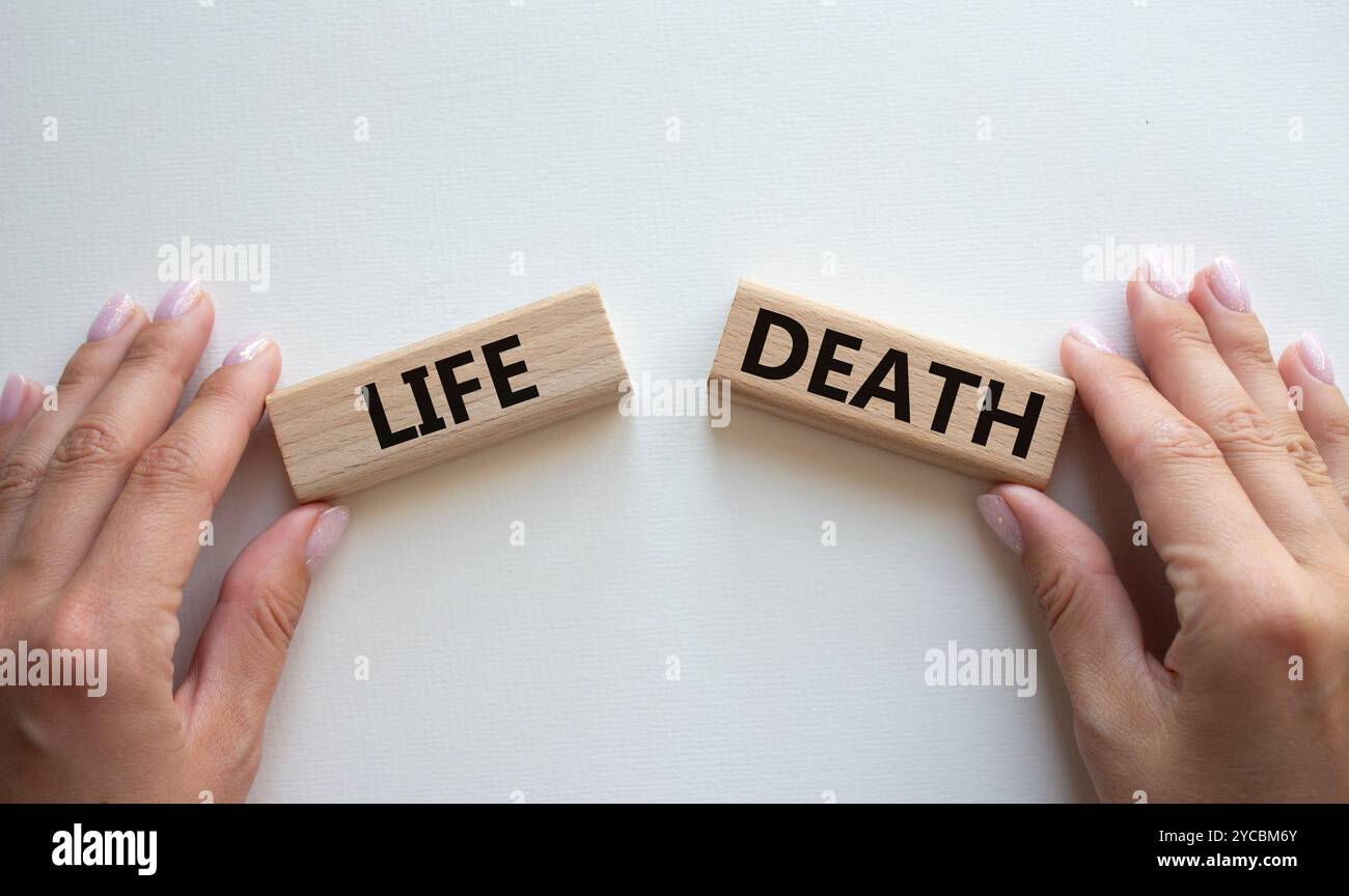 Life or Death symbol. Concept word Life or Death on wooden blocks ...