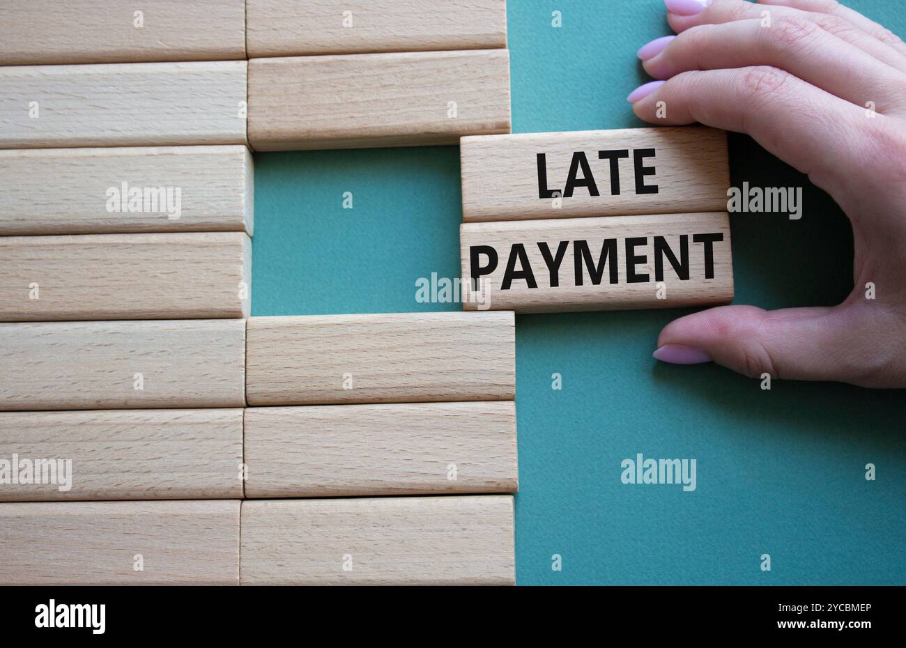 Late payment symbol. Concept word Late payment on wooden blocks ...