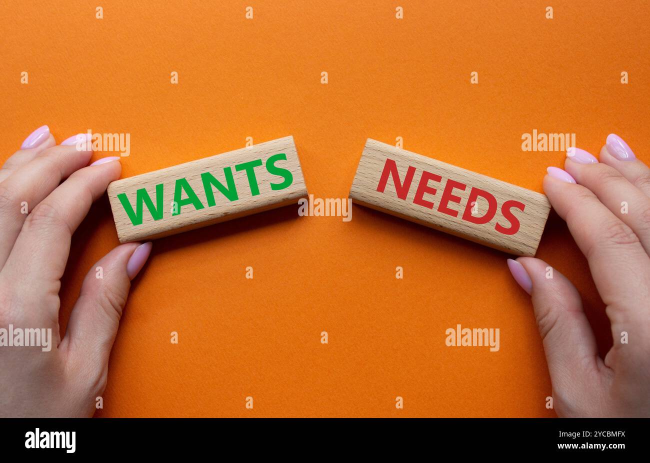 Wants and Needs symbol. Concept word Wants and Needs on wooden blocks ...
