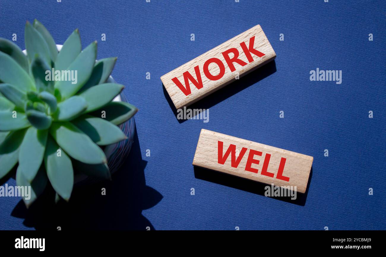 Work Well symbol. Concept word Work Well on wooden blocks. Beautiful ...