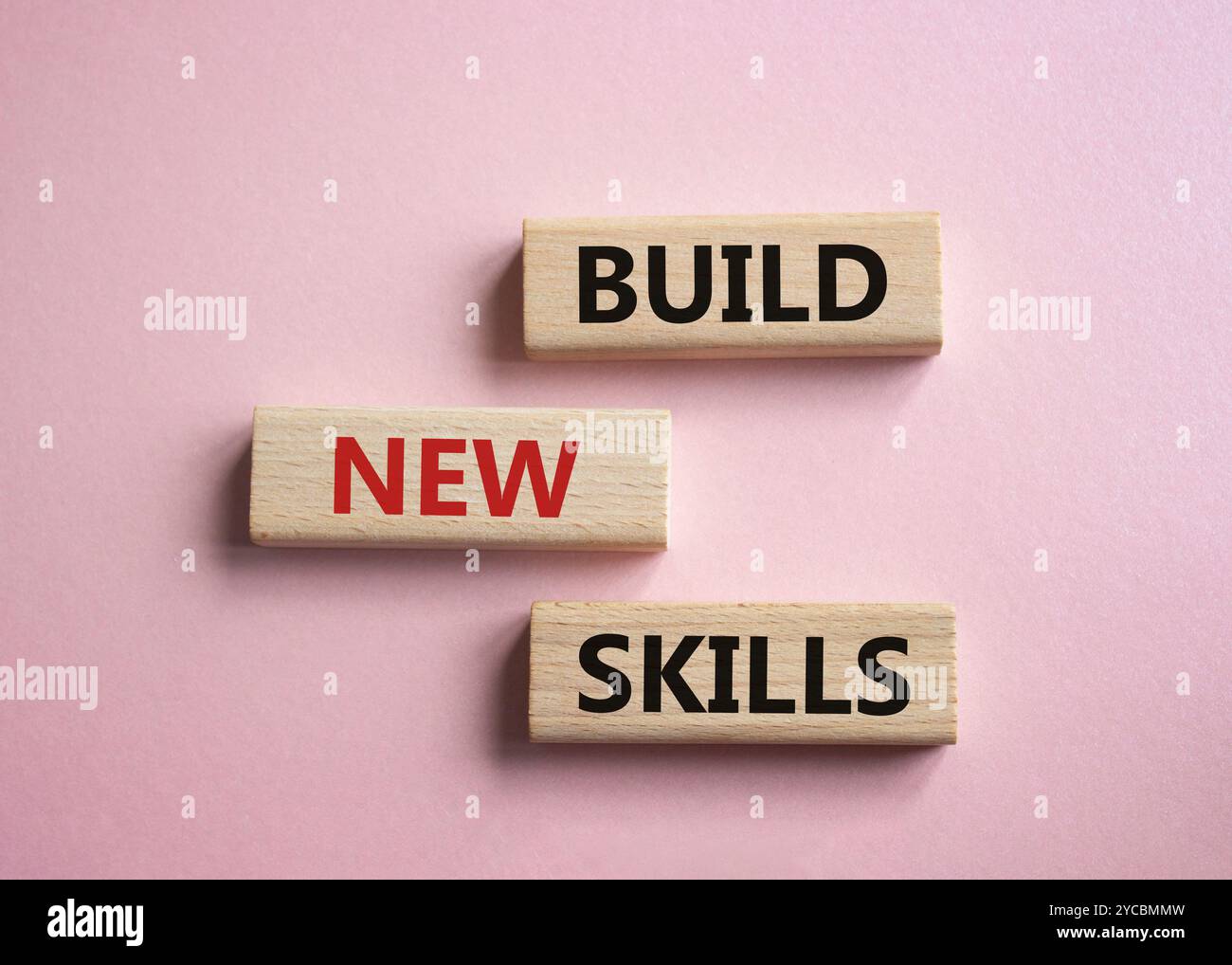Build New skills symbol. Concept word Build New skills on wooden blocks ...