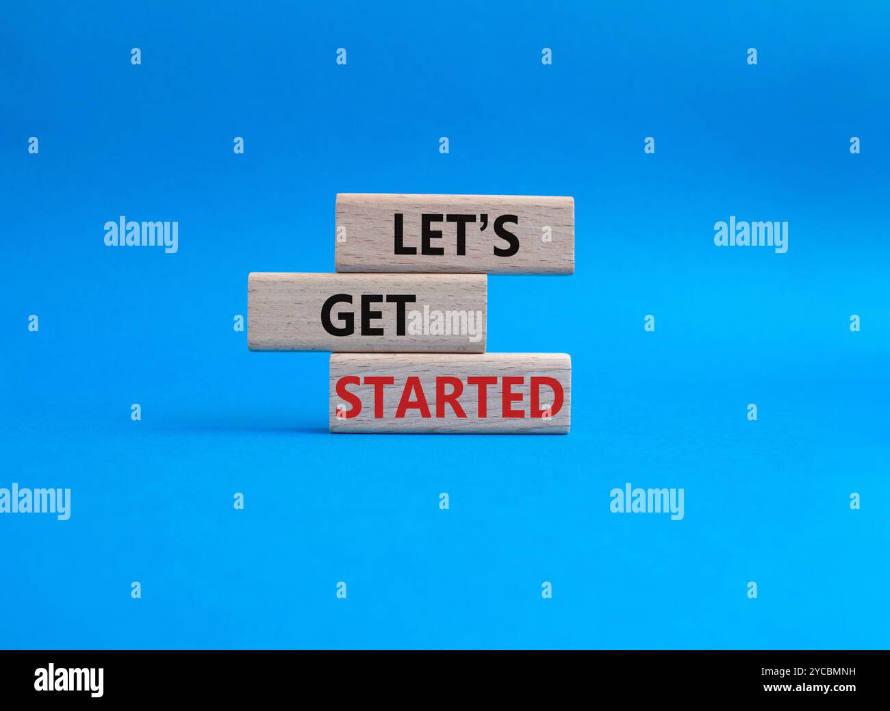 Lets get started symbol. Concept words Lets get started on wooden ...