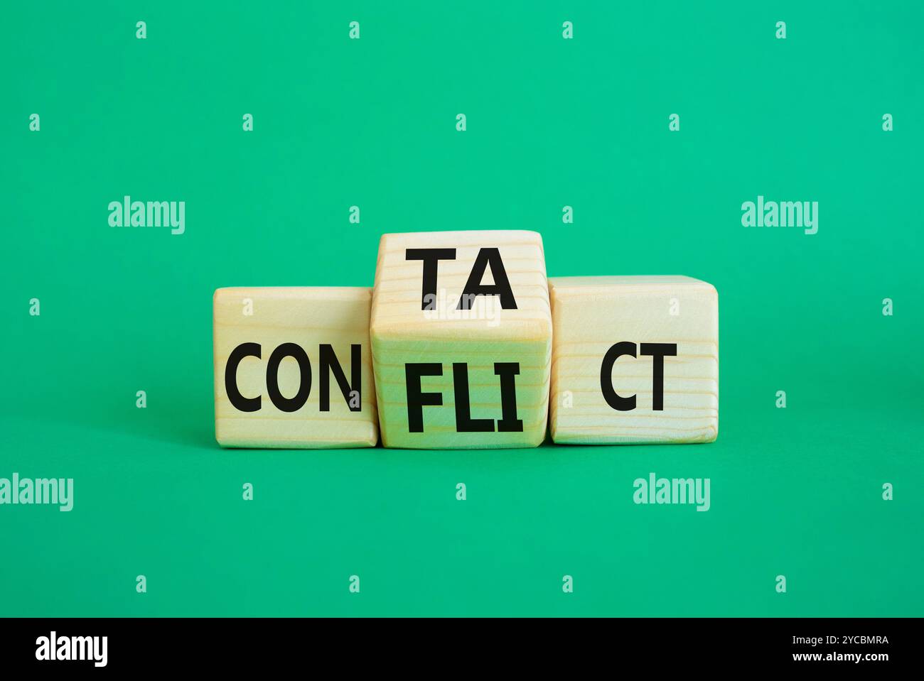 Contact and Conflict symbol. Wooden cubes with words Contact and ...