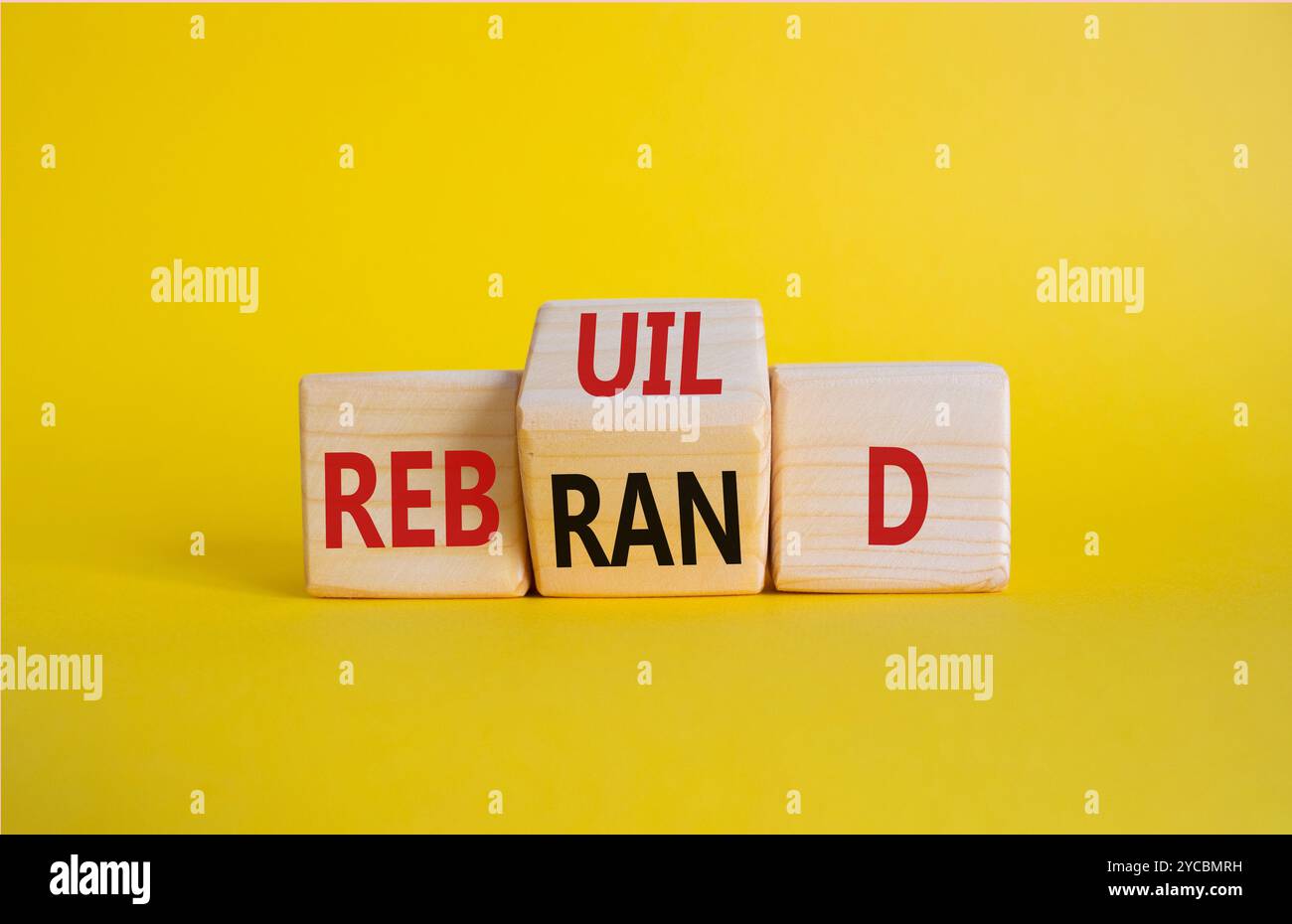 Rebuild and Rebrand symbol. Wooden cubes with words Rebrand and Rebuild ...