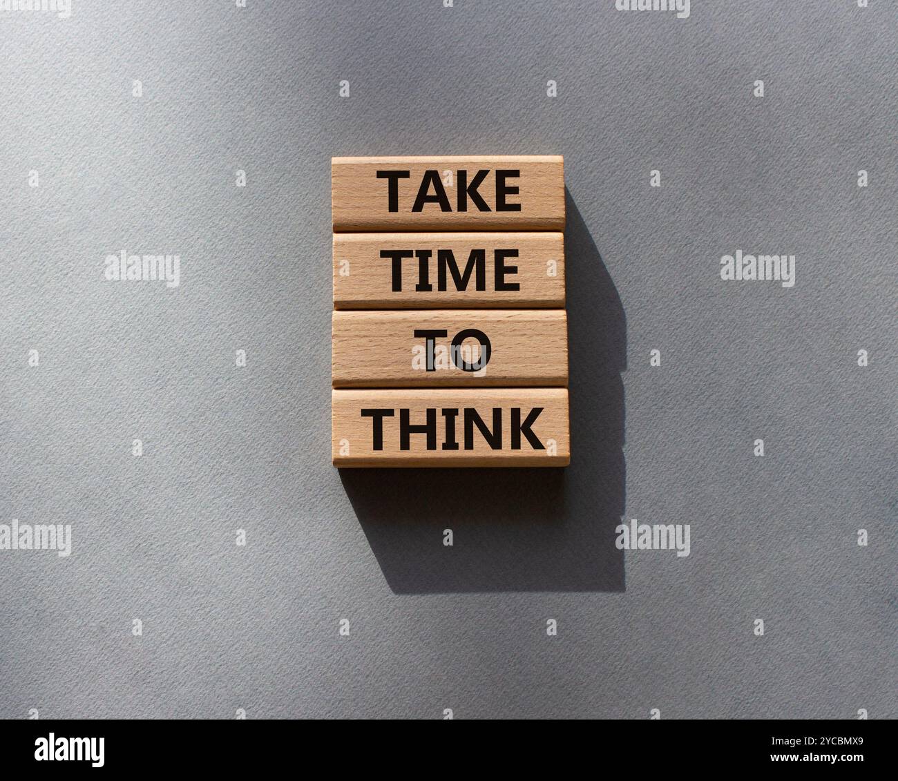 Take time to think symbol. Wooden blocks with words Take time to think ...