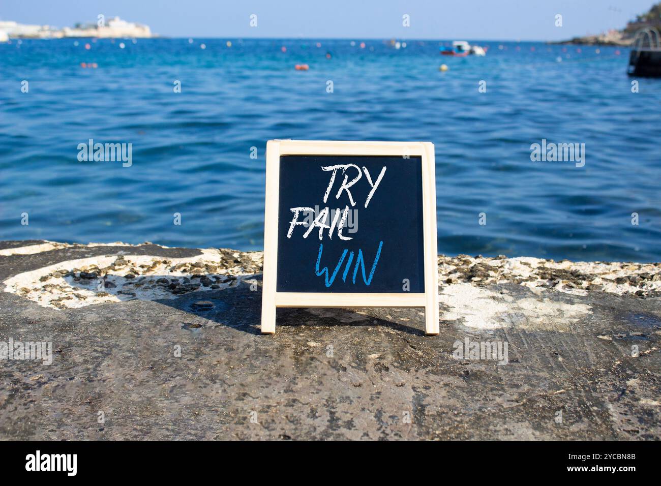 Try Fail Win symbol. Blackboard with words Try Fail Win. Beautiful sea ...