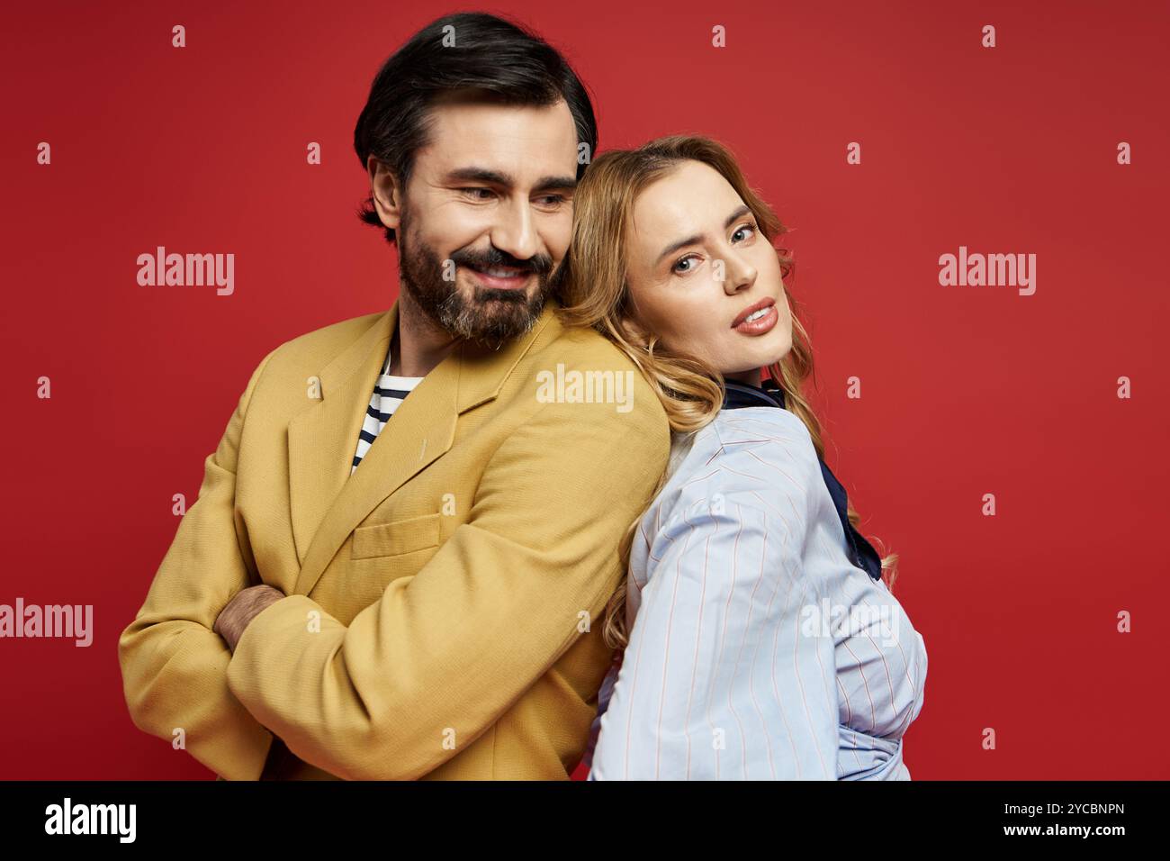 A cheerful middle aged couple shows off their lively personalities ...