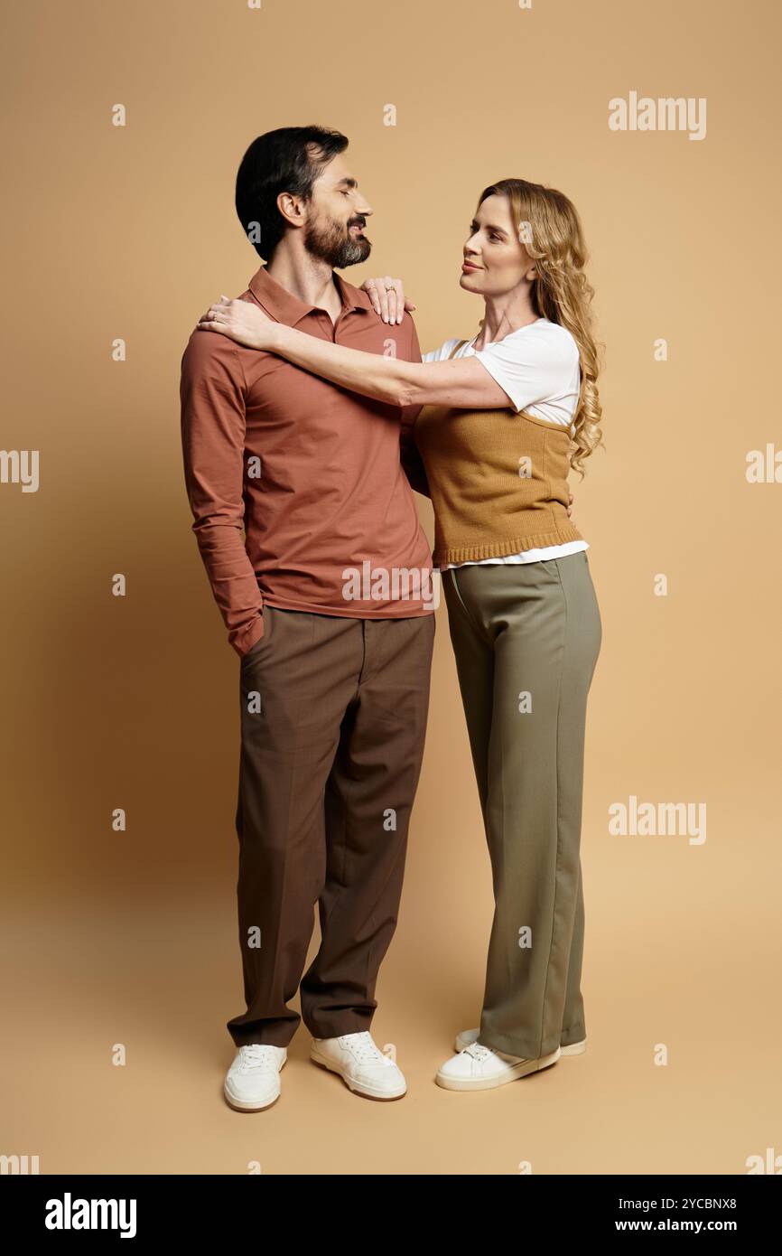 A couple stands together, expressing affection and connection through ...