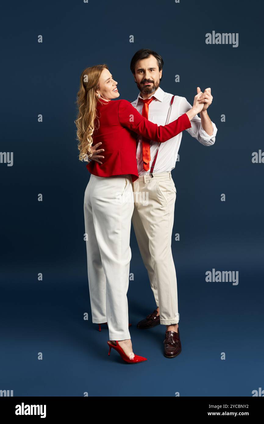 A joyful moment of a middle aged couple dancing elegantly together ...