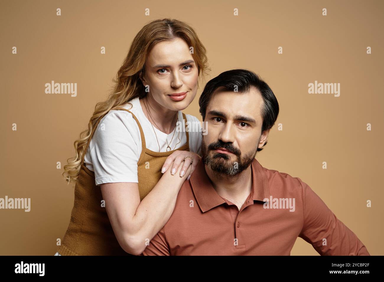 A middle aged couple exudes connection and warmth with gentle smiles in ...