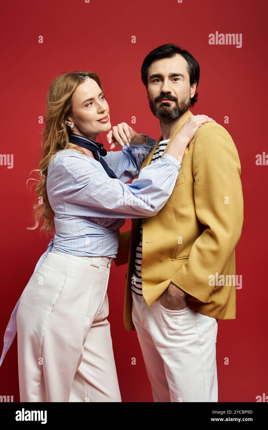 A middle aged couple stands confidently together, expressing their ...