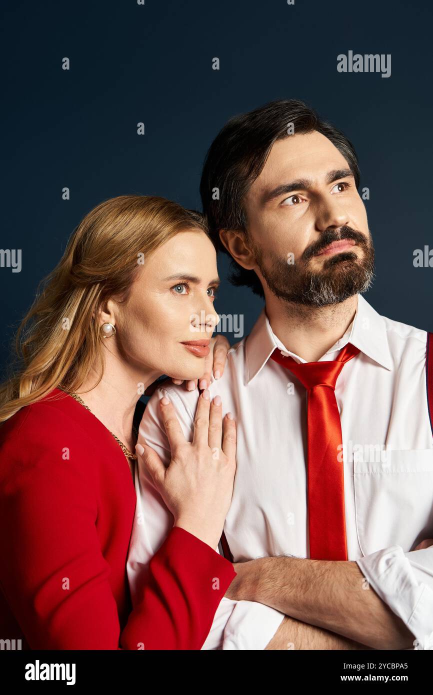 A middle aged couple shares an intimate moment, dressed in elegant ...