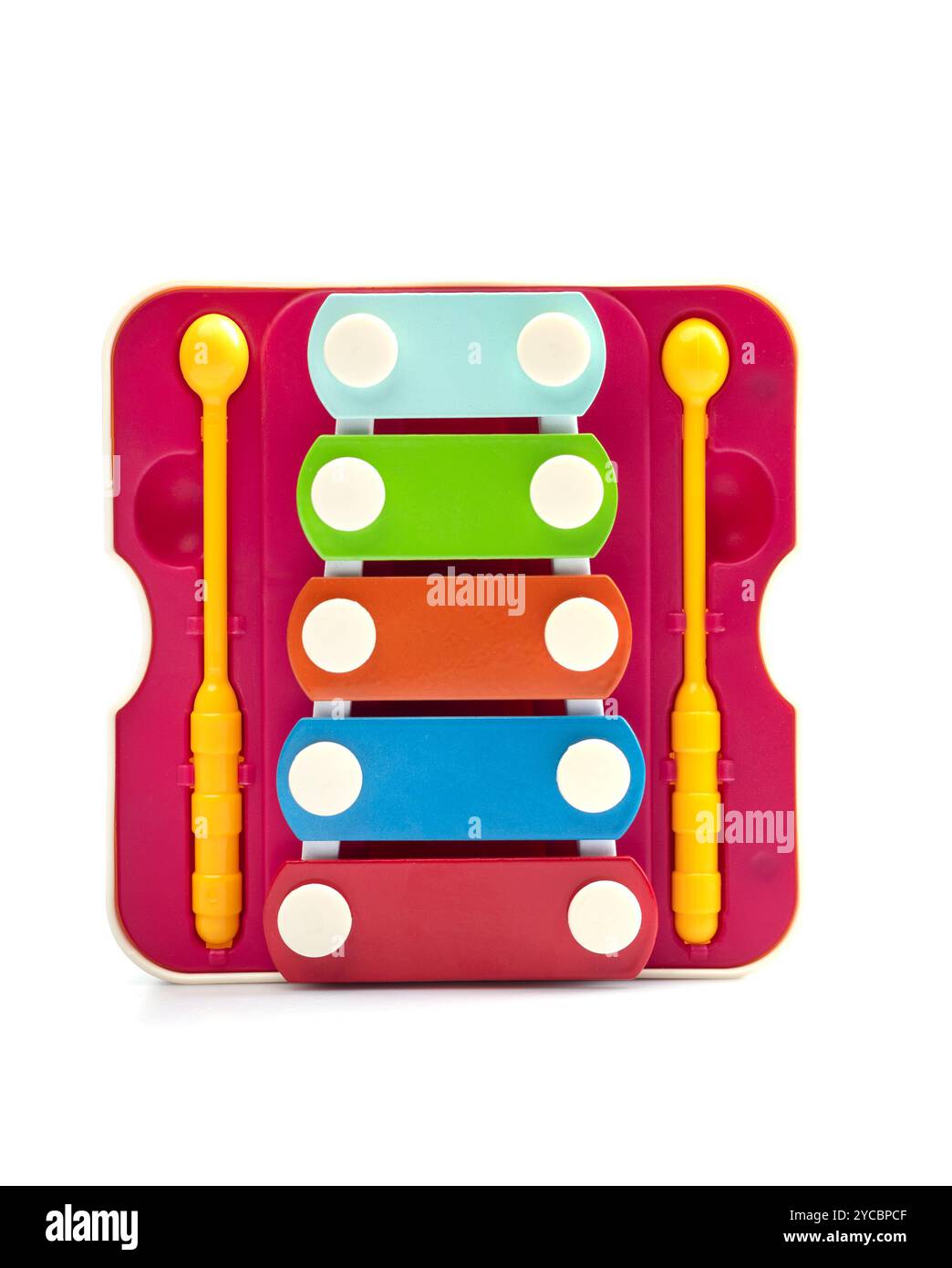 Colored toy educational xylophone with two sticks on a white background ...