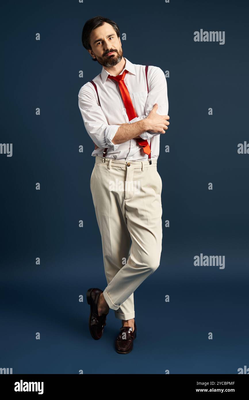 A well dressed man stands with arms crossed, exuding confidence in a ...