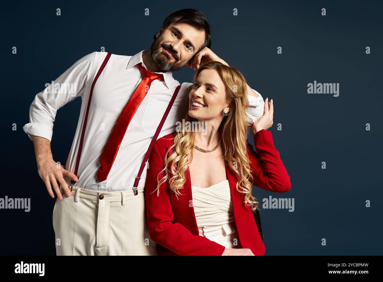 The couple shares a joyful moment, showcasing their fashionable attire ...