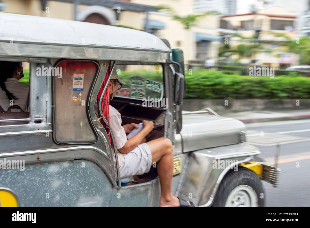Manila,Philippines-January 13 2023:The colorful,rustic vehicles rush ...