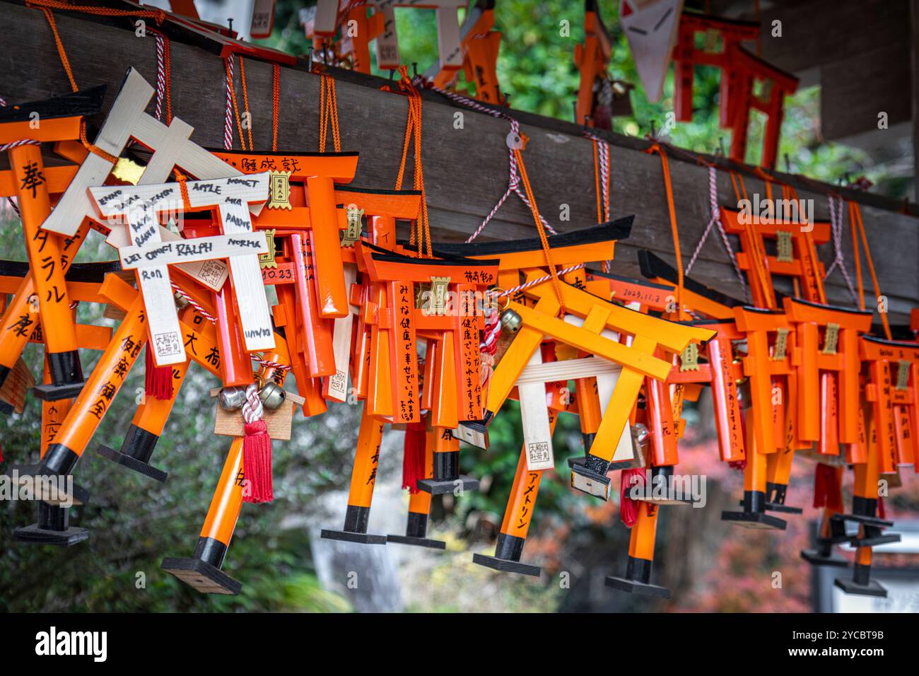 colored torii gates hanging at japanese shrine fushimi inari Stock ...