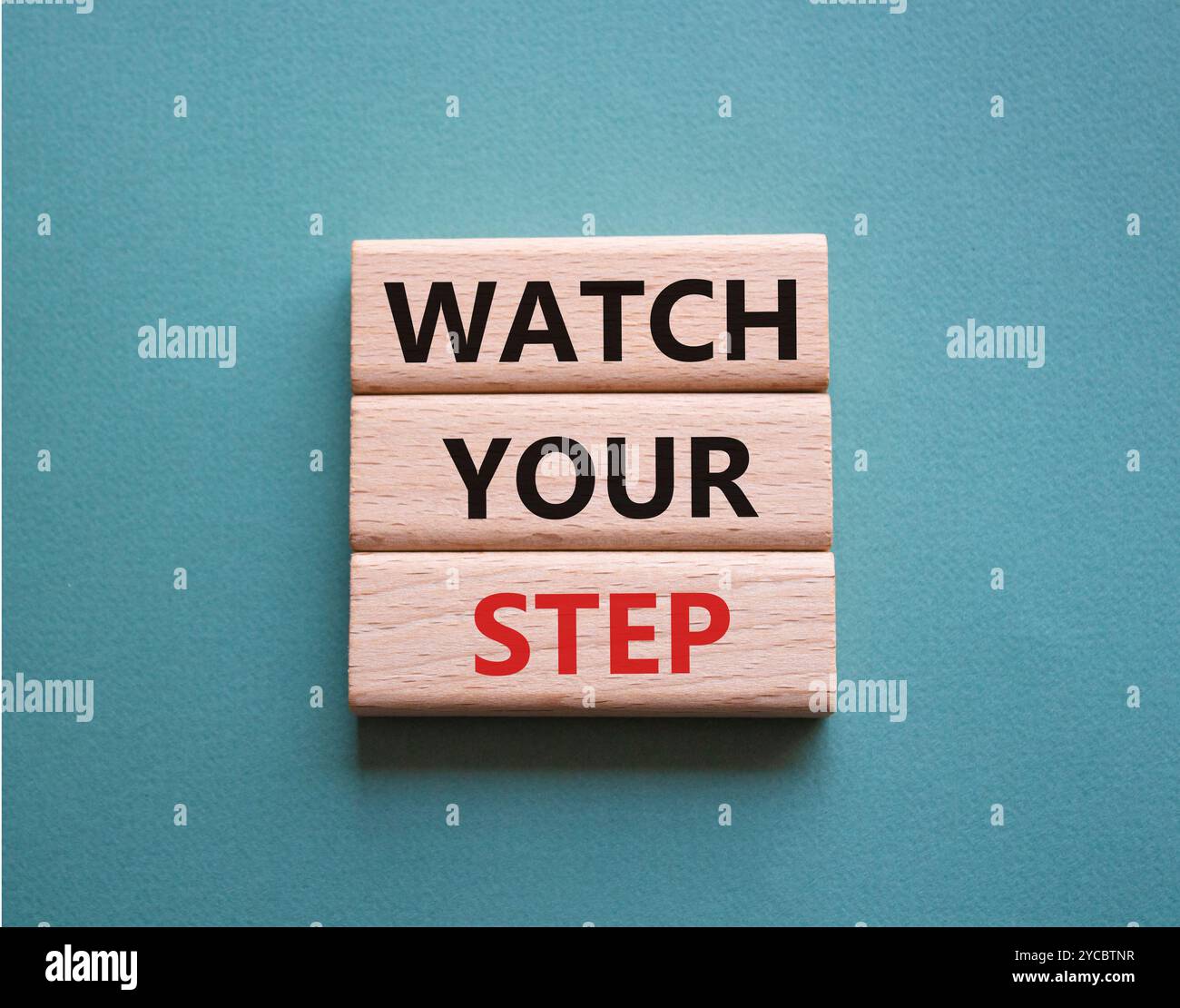Watch your Step symbol. Concept words Watch your Step on wooden blocks ...