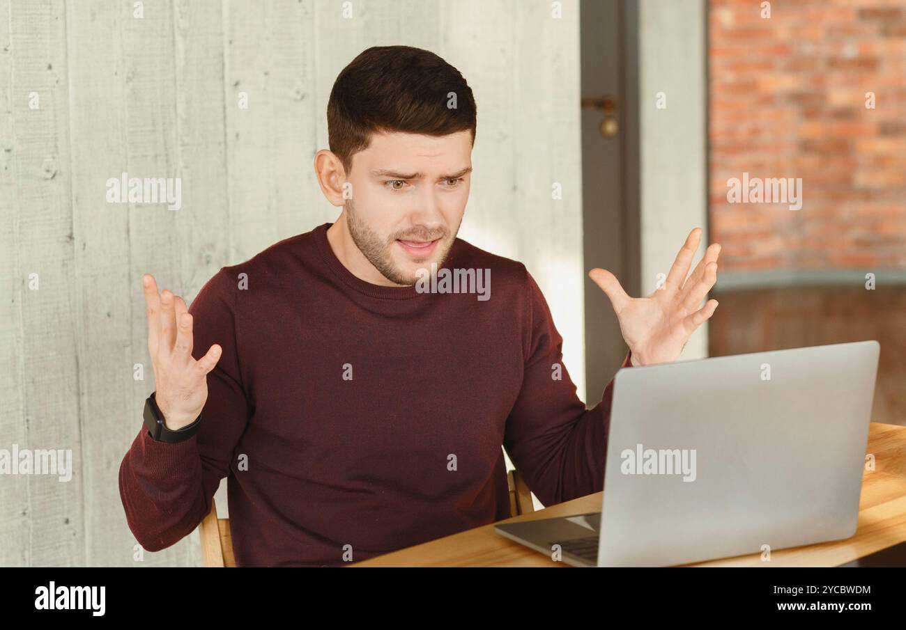 Man At Laptop Having Problem At Work Indoor Stock Photo - Alamy