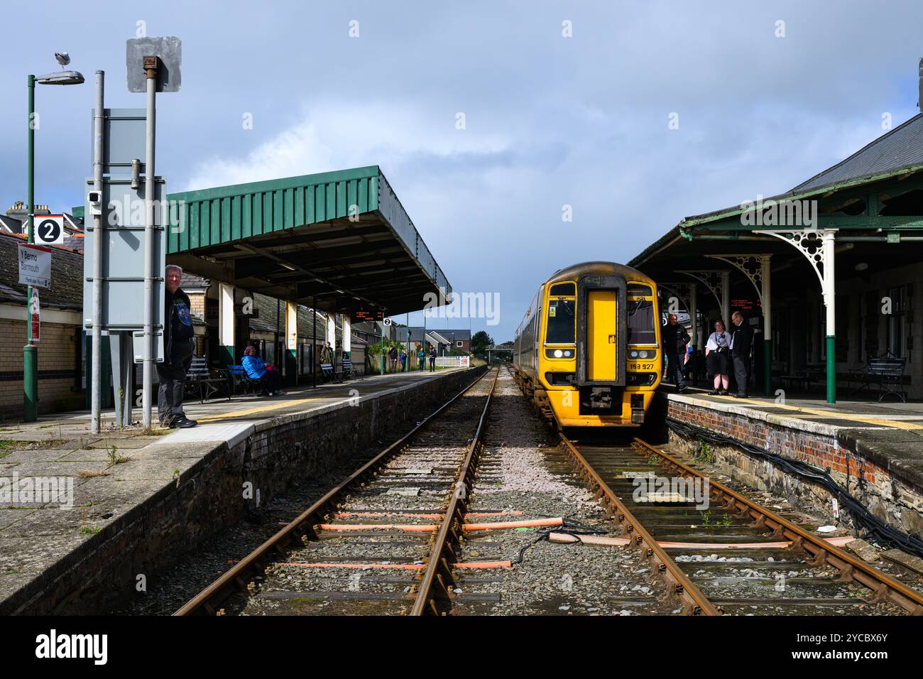 Barmouth, Wales, UK - September 12, 2024; Passengers and staff wait at ...