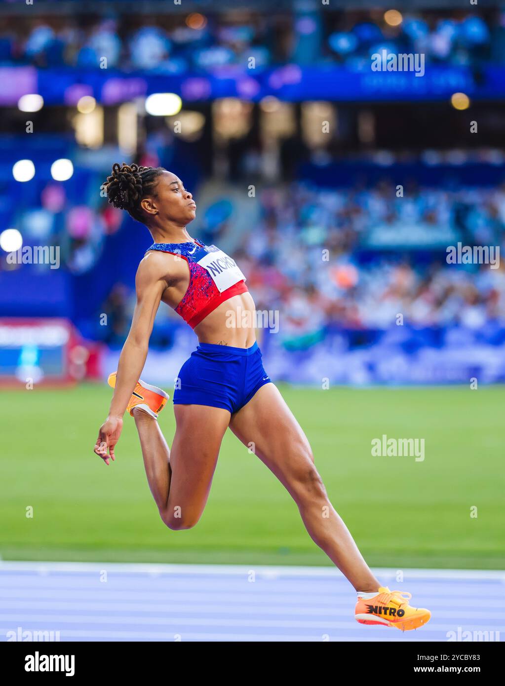 Monae' Nichols participating in the long jump at the Paris 2024 Olympic ...