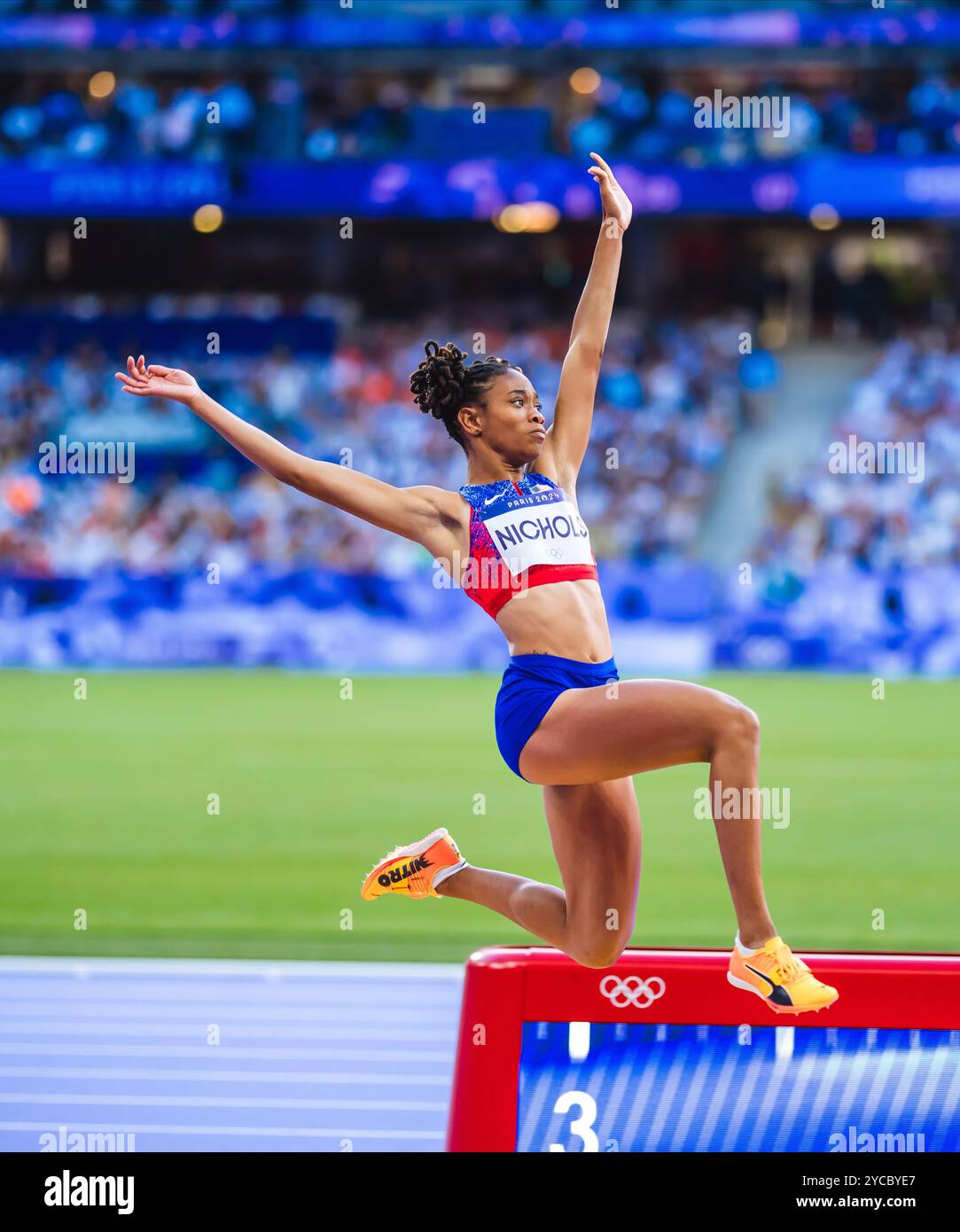 Monae' Nichols participating in the long jump at the Paris 2024 Olympic ...