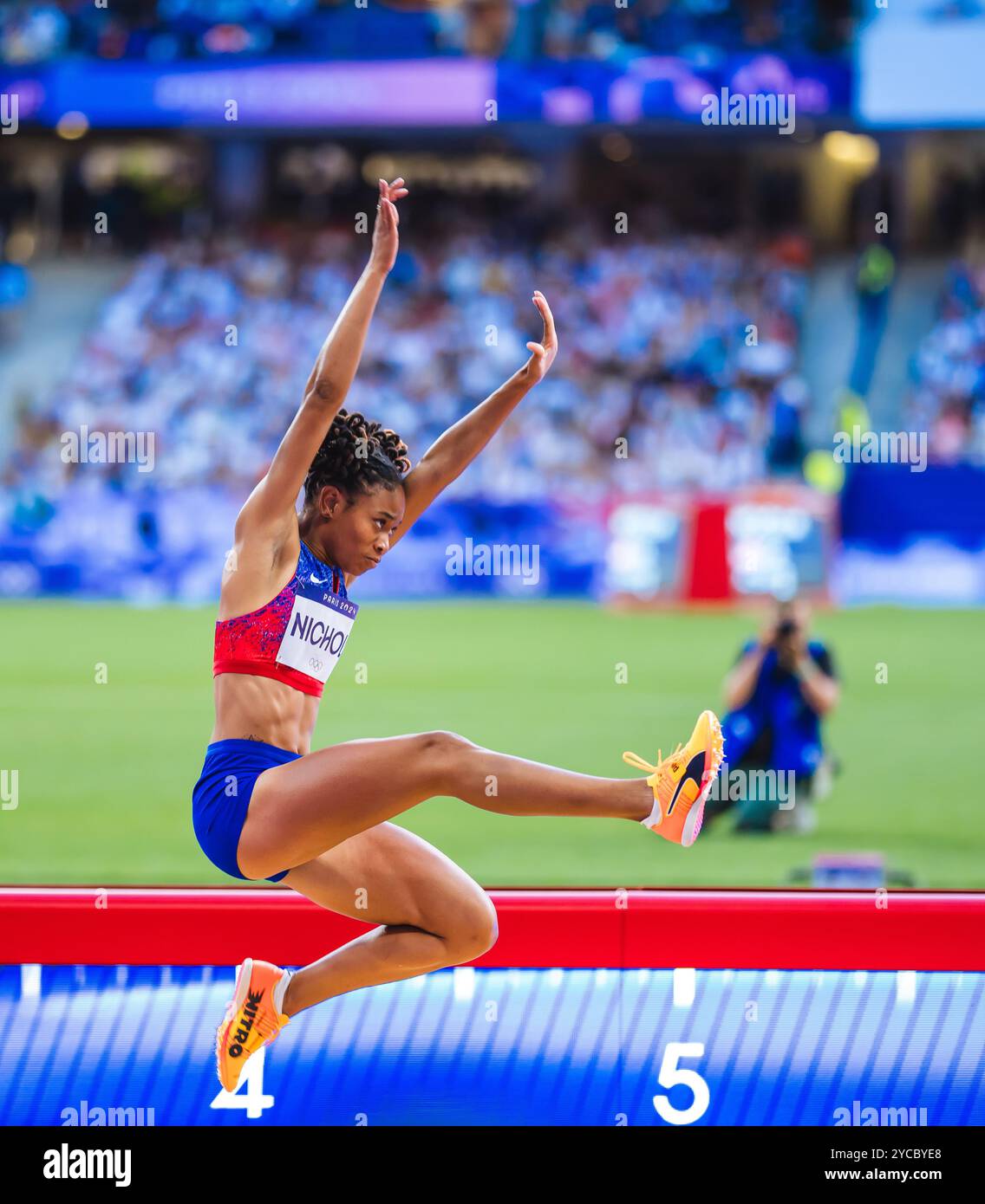 Monae' Nichols participating in the long jump at the Paris 2024 Olympic ...