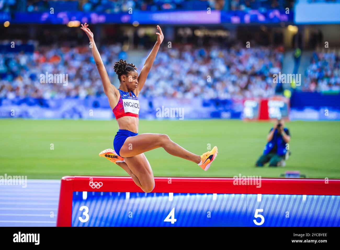 Monae' Nichols participating in the long jump at the Paris 2024 Olympic ...