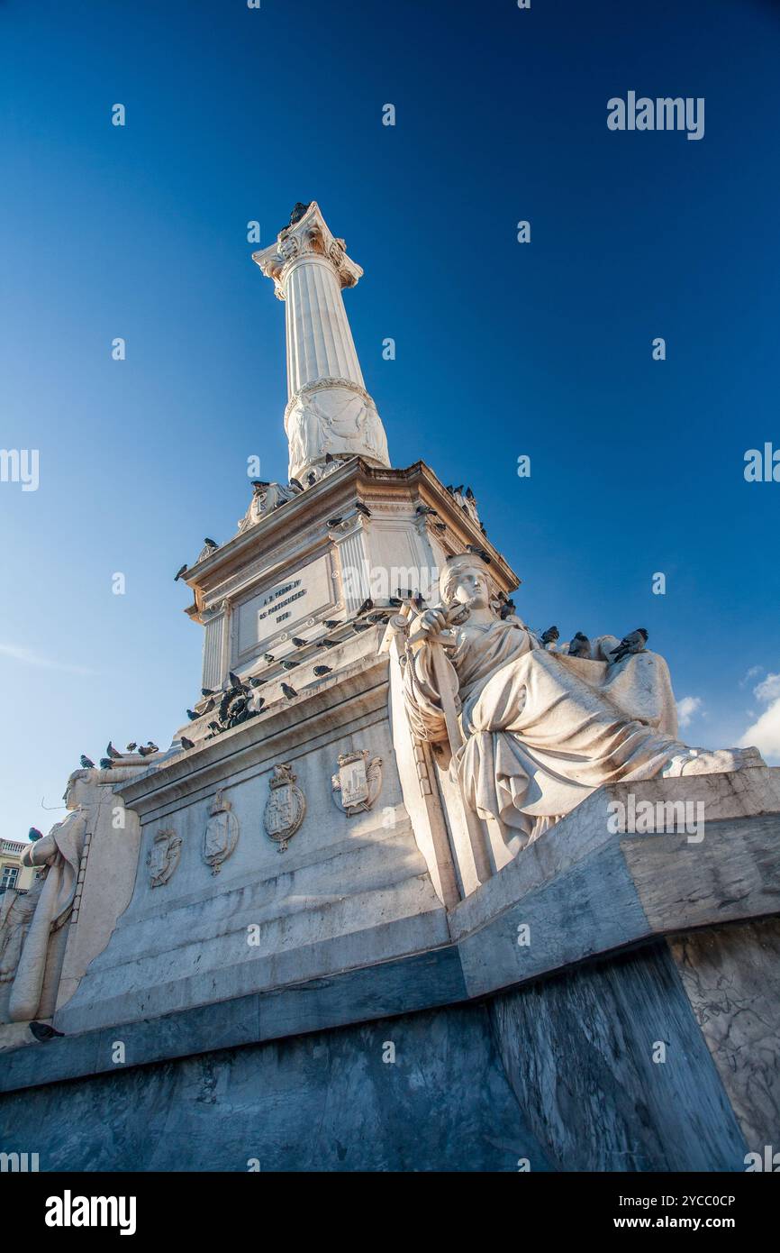 The impressive monument of King Dom Pedro IV stands tall in Rossio ...