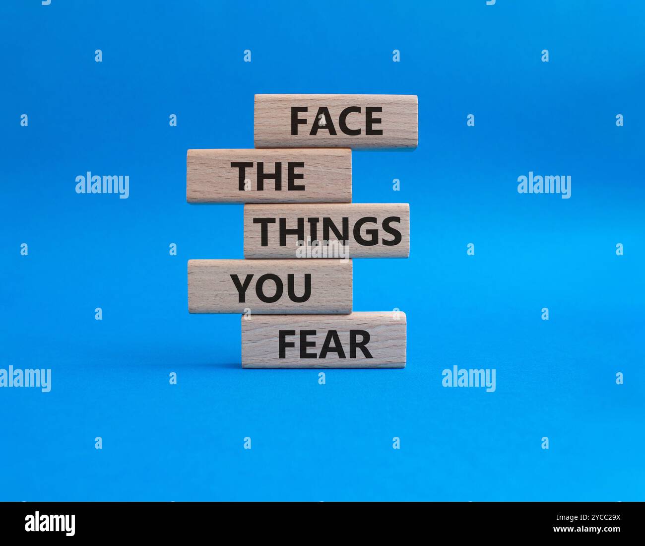 Face the things you fear symbol. Wooden blocks with words Face the ...