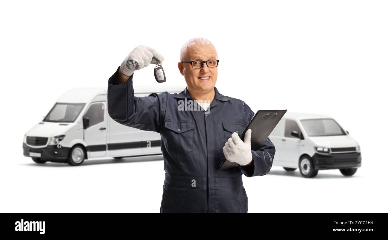 Auto mechanic holding a van key and a clipboard isolated on white ...