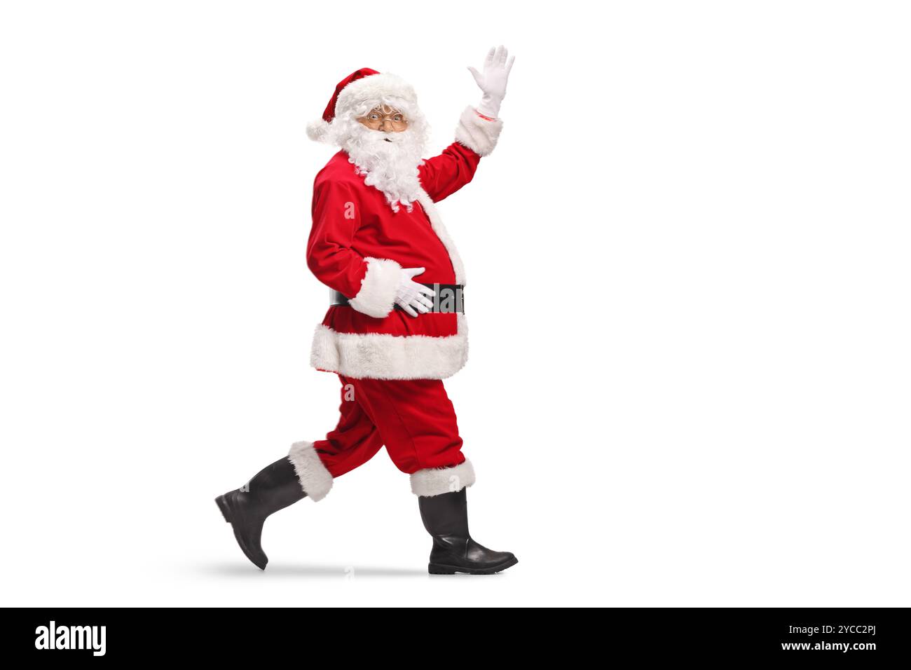 Santa Claus walking and waving at camera isolated on white background ...