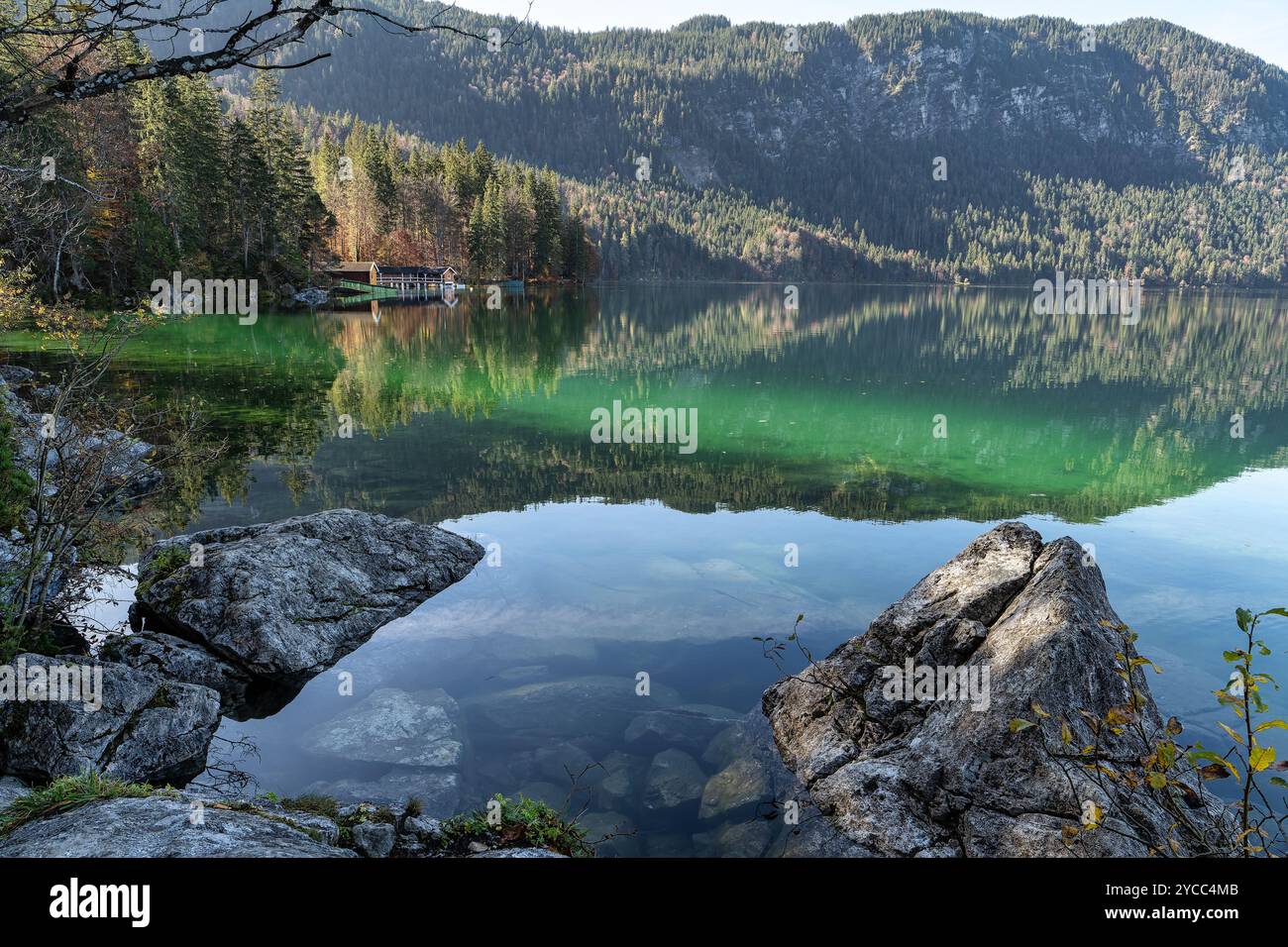 Autumn colors in fall at lake Eibsee. Alpine landscape with German Alps ...