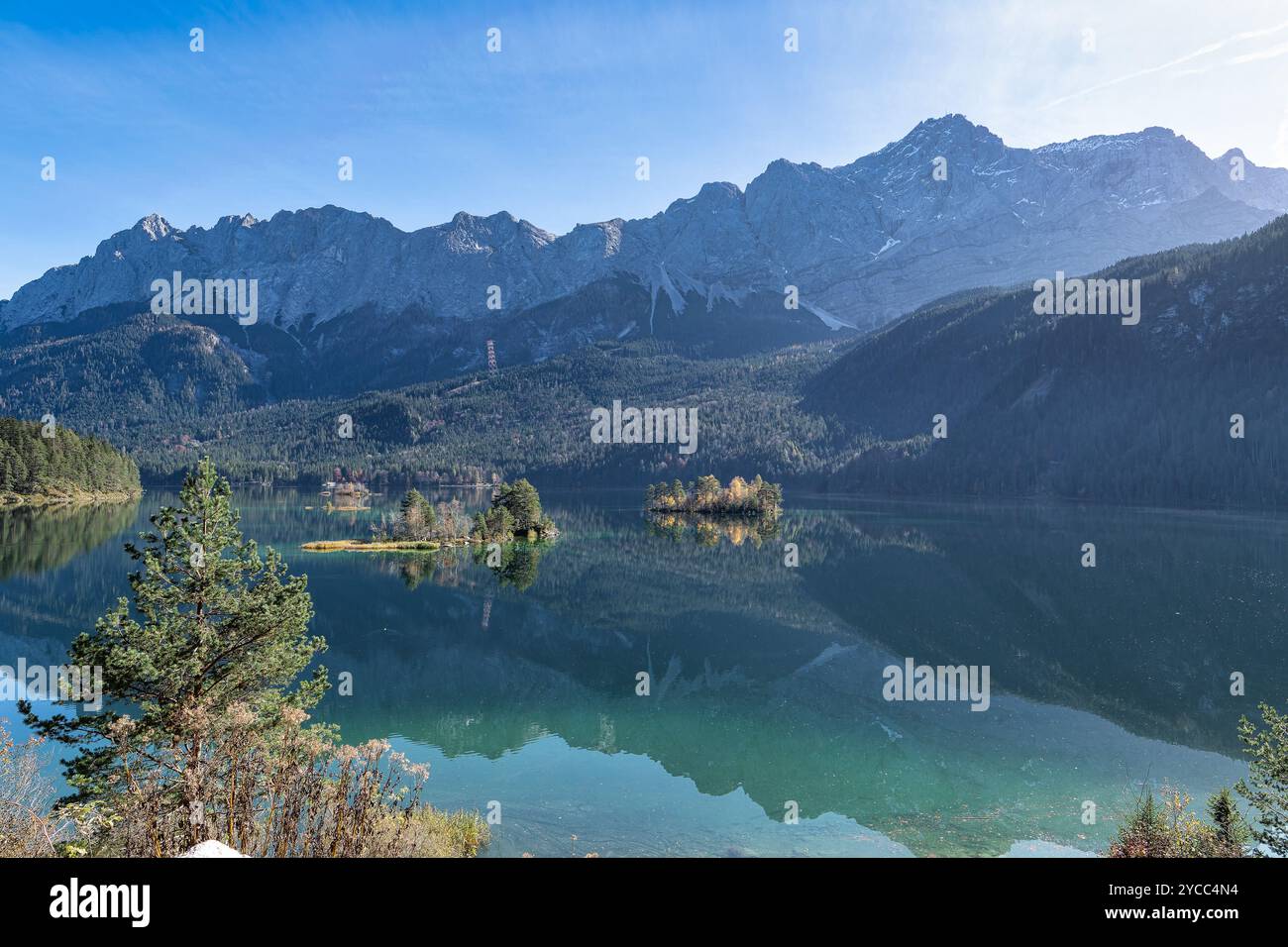 Autumn colors in fall at lake Eibsee. Alpine landscape with German Alps ...