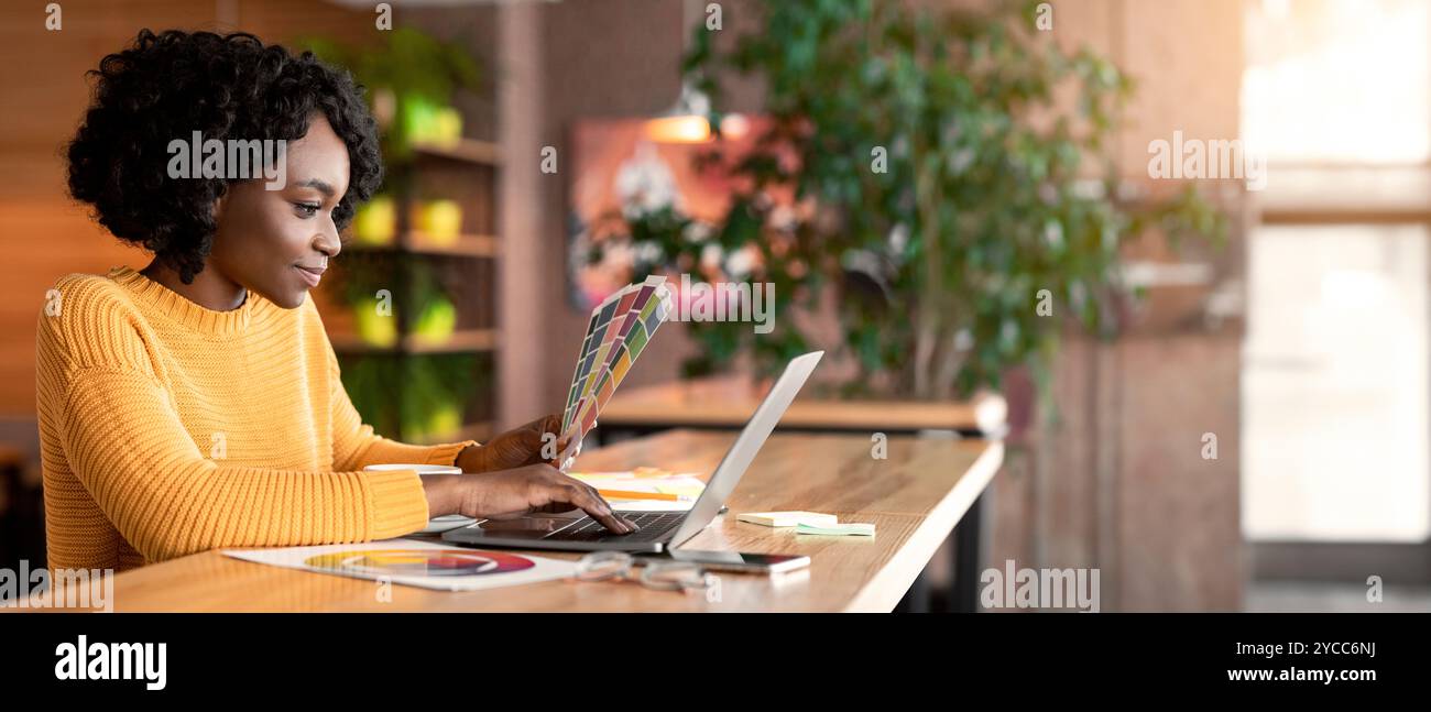 Afro girl web-designer working with color palette at cafe Stock Photo ...