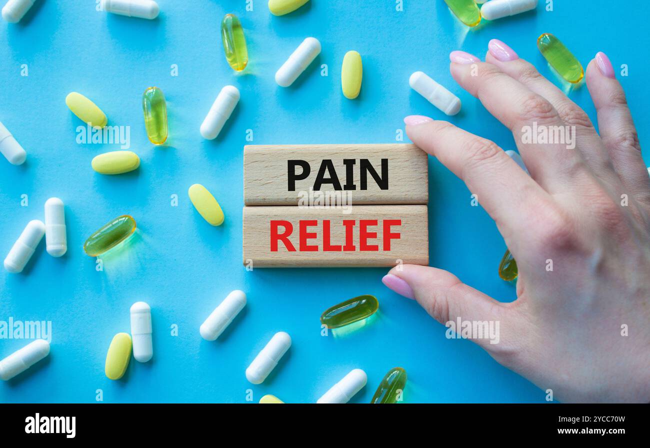 Pain Relief symbol. Concept word Pain Relief on wooden blocks ...