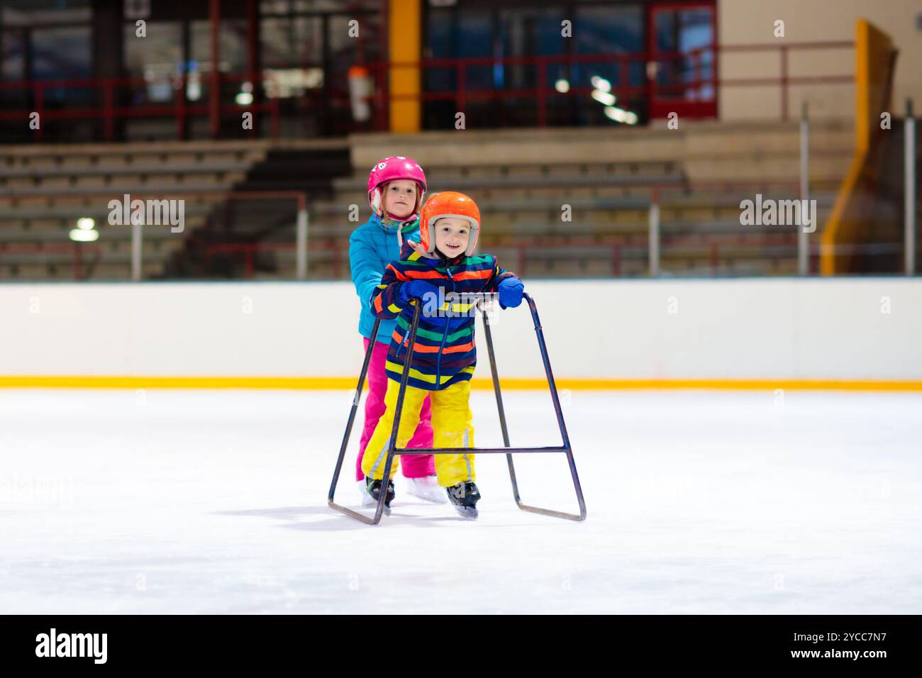 Child skating on indoor ice rink. Kids skate. Active family sport ...