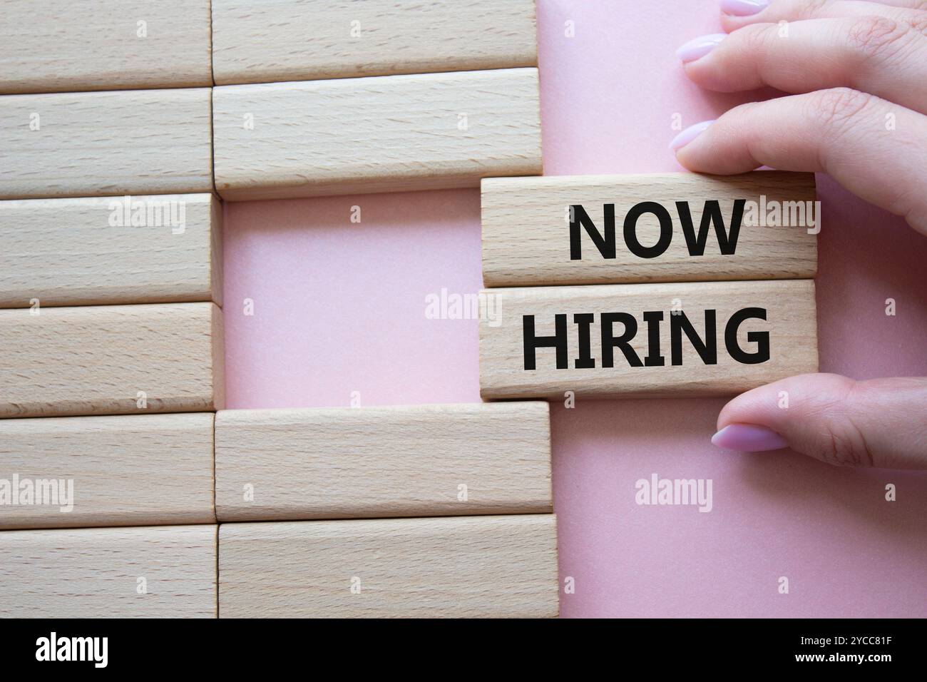 Now Hiring symbol. Concept word Now Hiring on wooden blocks ...