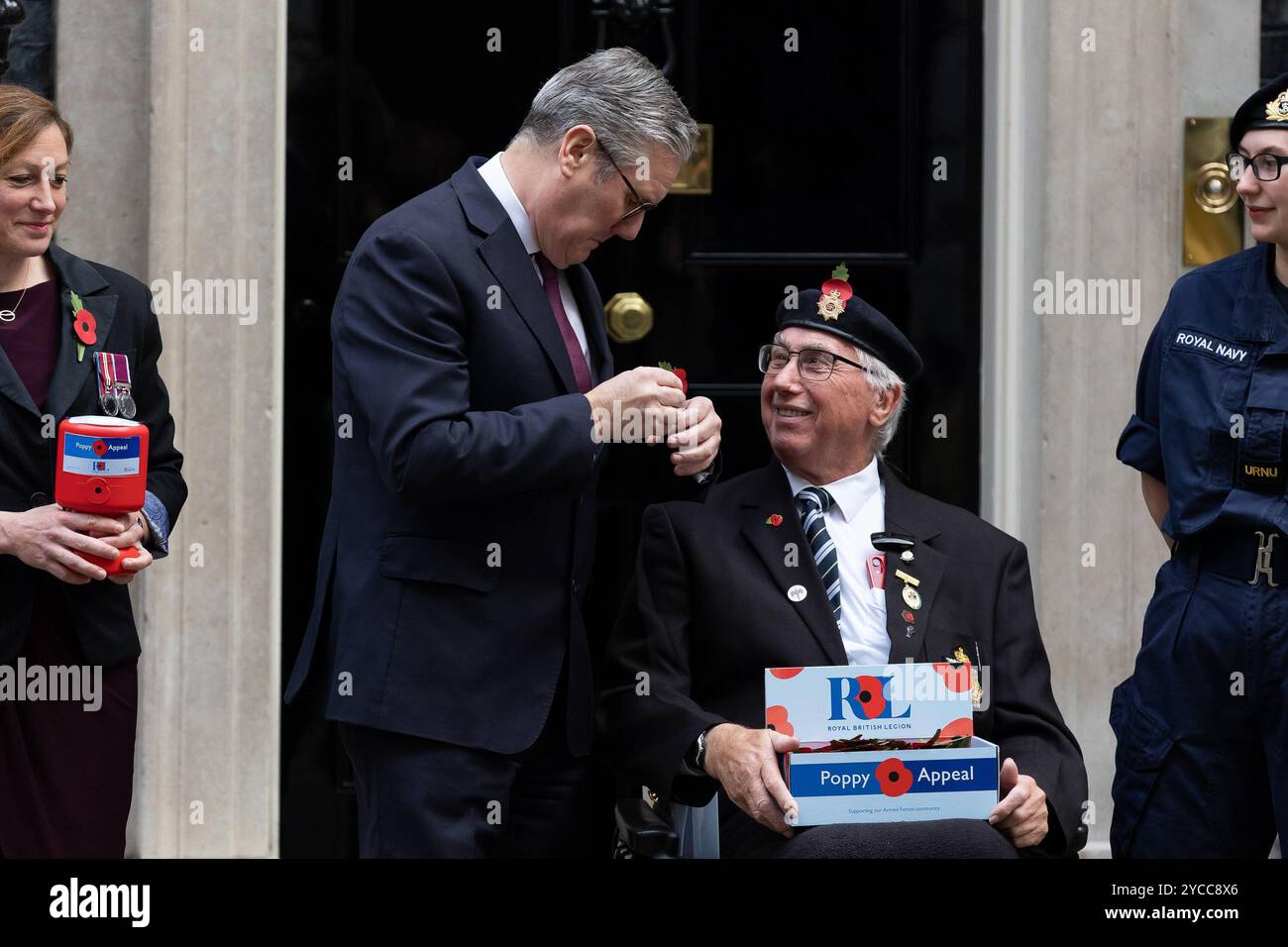 London, UK. 22nd Oct, 2024. British Prime Minister Keir Starmer pins a ...