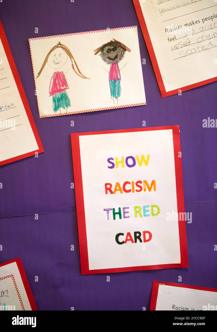 Childrens artwork and message about racism Stock Photo - Alamy