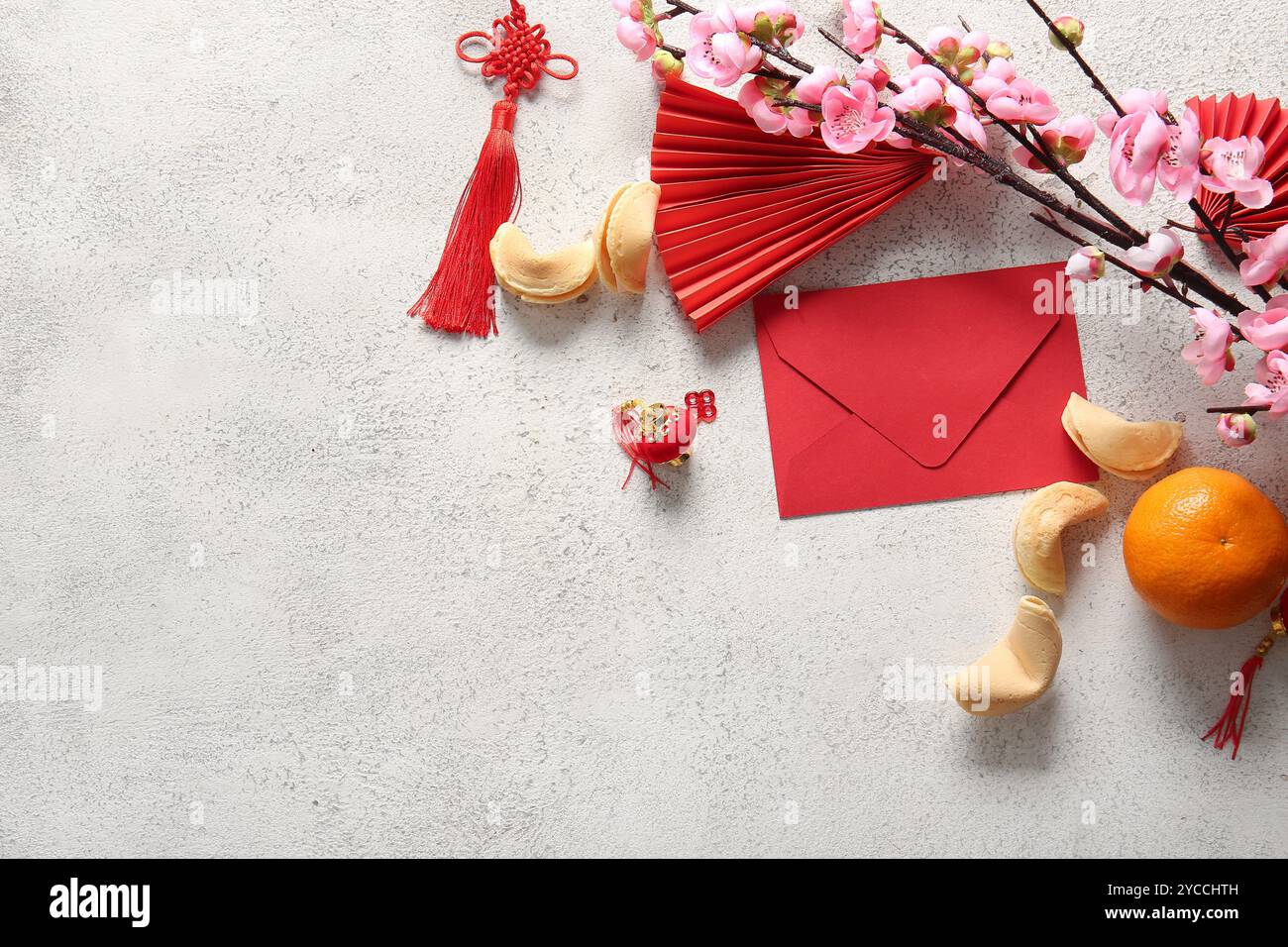 Sakura branch with Chinese symbols, fortune cookies and mandarin on ...