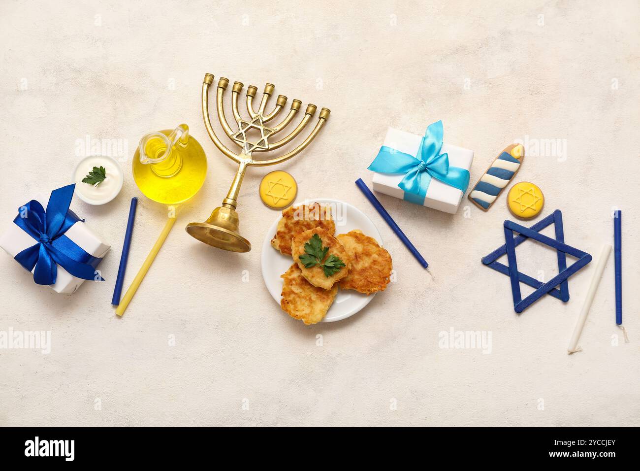 Composition for Hanukkah celebration with potato pancakes, menorah ...