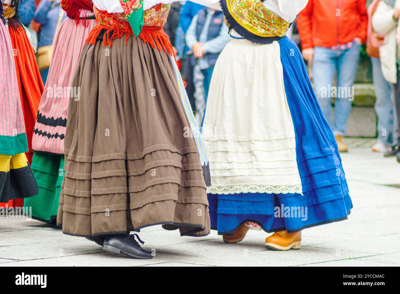 women dressed in the traditional costume of Galicia dancing popular ...