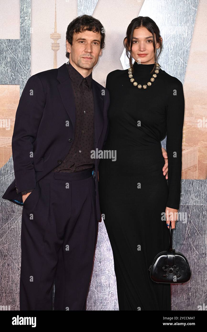 London, UK. October 22nd, 2024. Emory Ault and Nick Blood arriving at ...