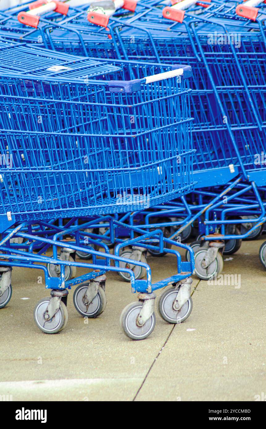 blue stacked metal shopping carts for supermarkets Stock Photo - Alamy