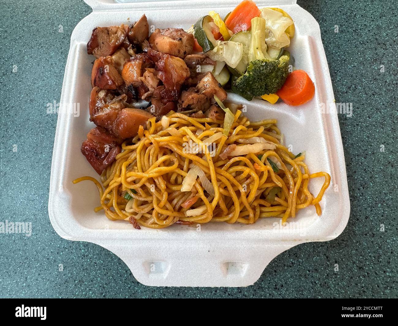 Plate of food court - Bourbon chicken with noodles and vegetables Stock ...