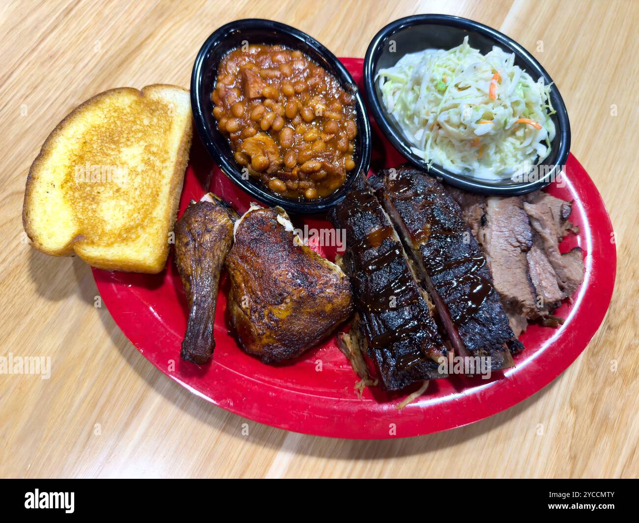 An American dinner of barbecued chicken, ribs and beef brisket with ...