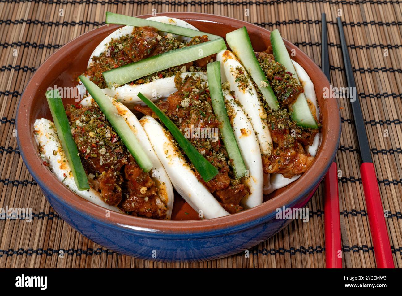 Bowl of Bao buns filled with barbecued pulled pork Stock Photo - Alamy